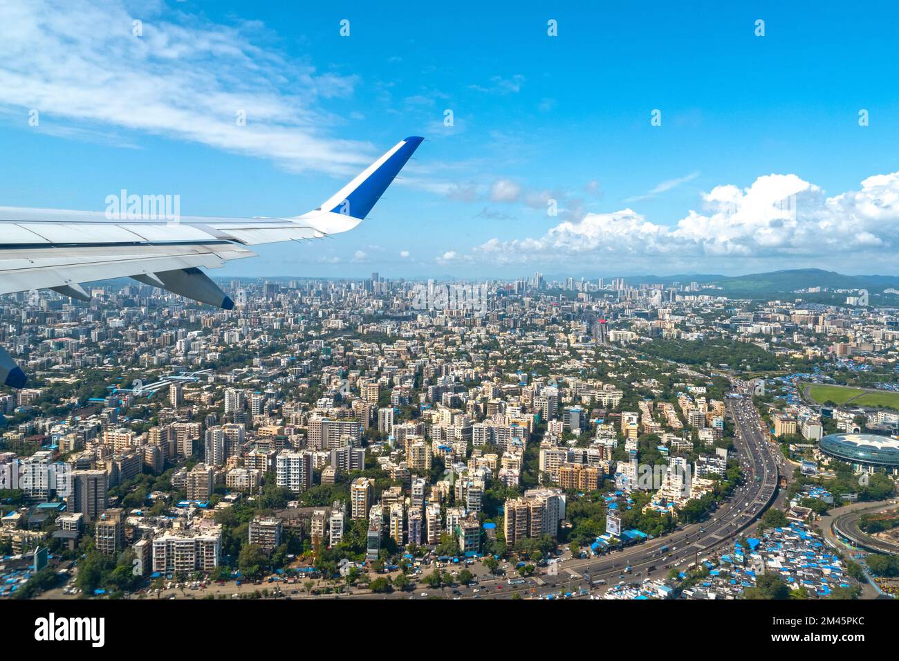 Airplane flying over high buildings hi-res stock photography and images ...