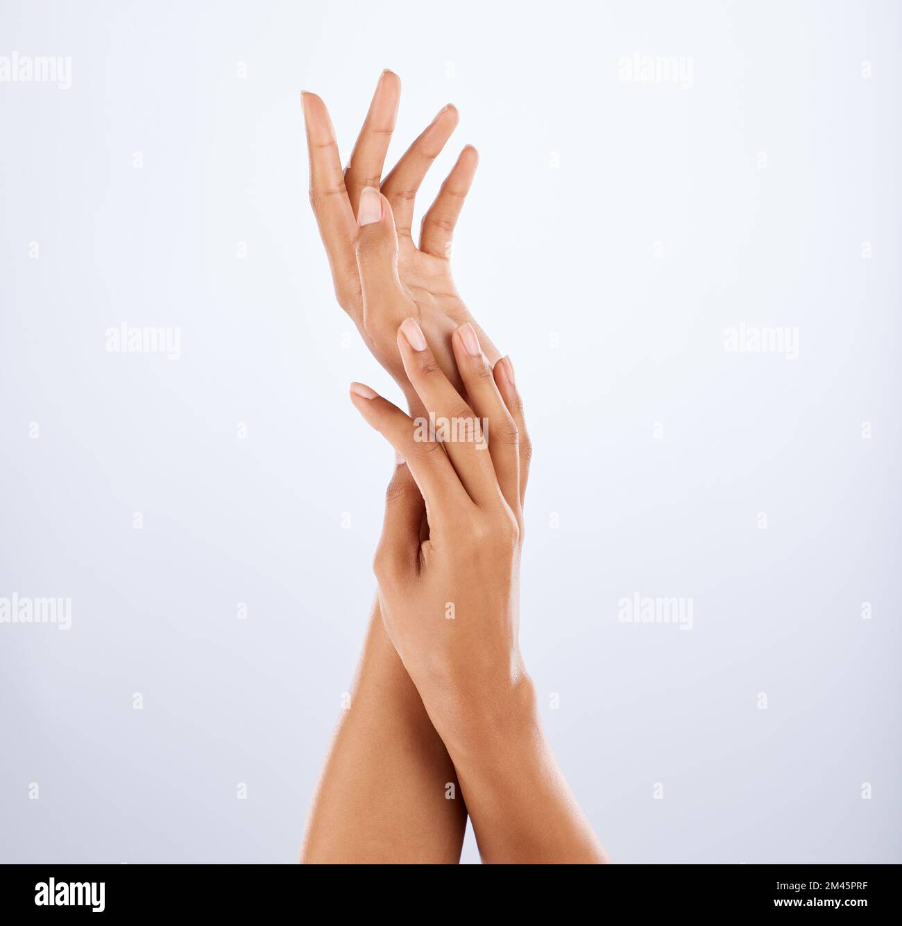Clean hands, skin care and body of woman on studio background for ...
