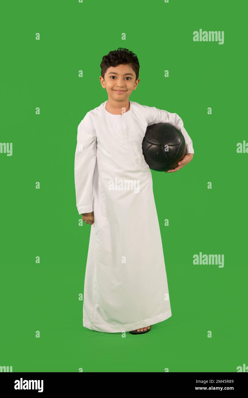 Arab boy with a football Stock Photo - Alamy