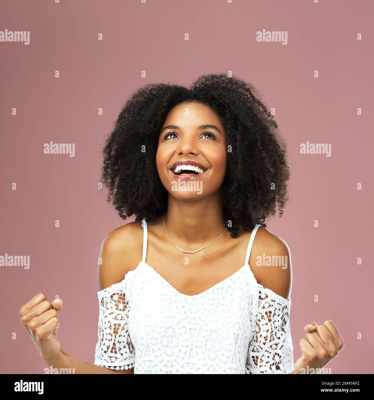 My luck has finally changed. a beautiful young woman cheering against a ...