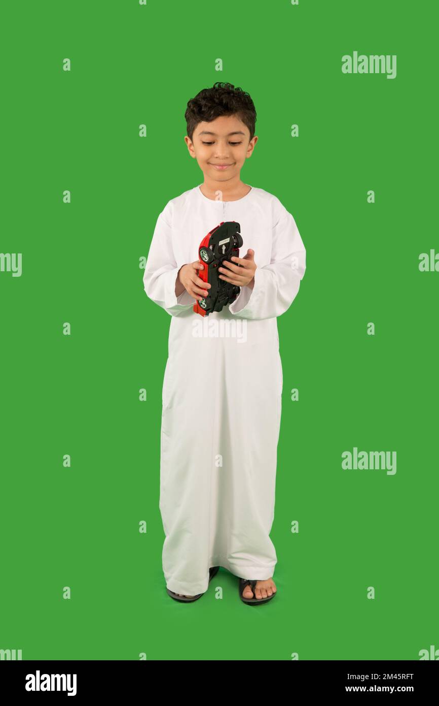 Arab boy holding toy car Stock Photo - Alamy