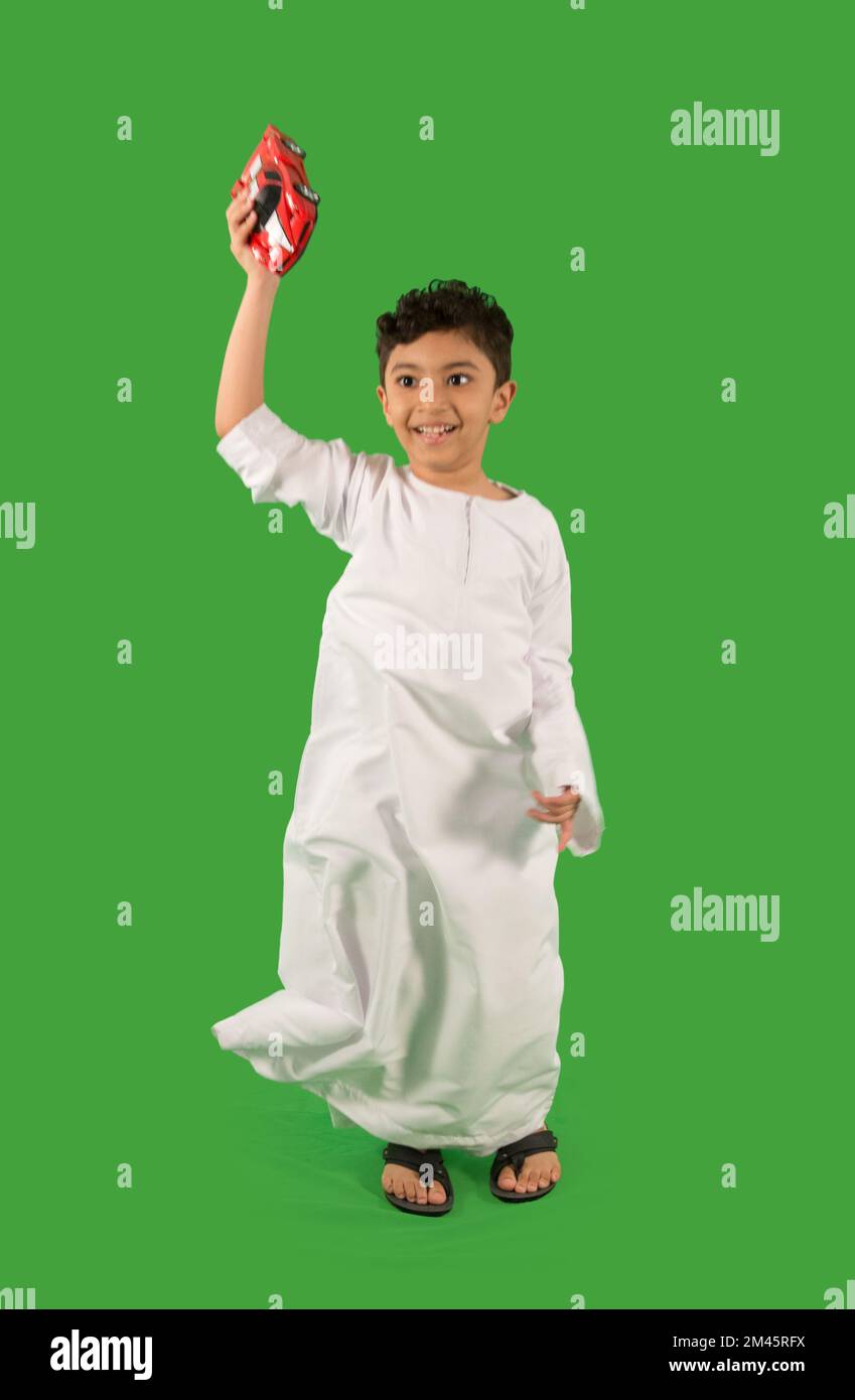 Arab boy holding toy car Stock Photo - Alamy