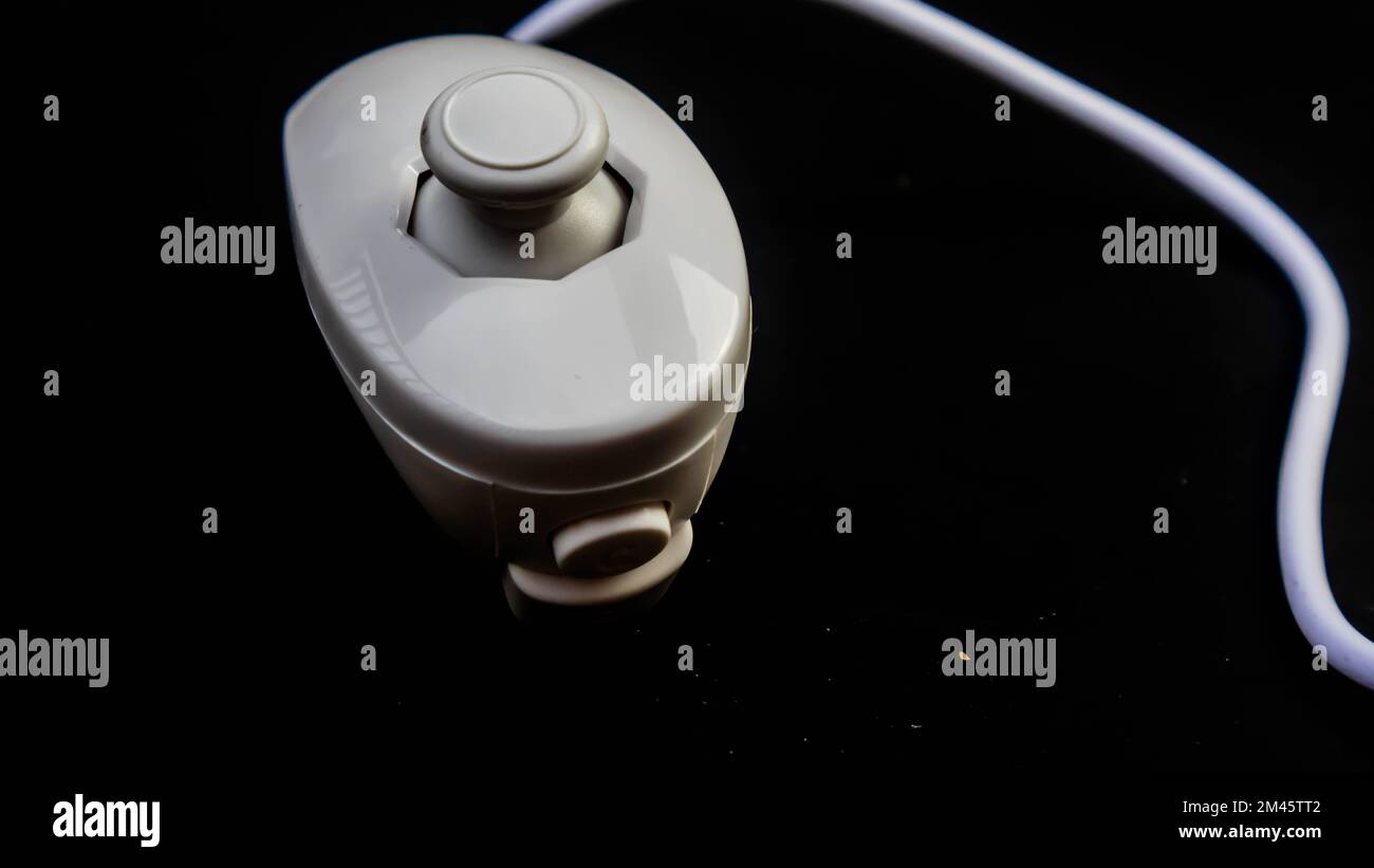 white joystick isolated on black background Stock Photo - Alamy