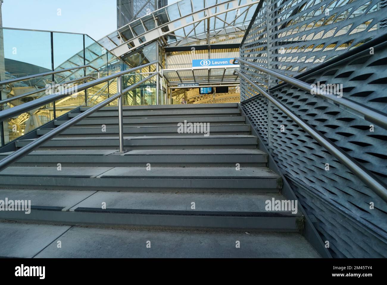 A low-angle shot of stairs to the railway platforms in Leuven railway ...