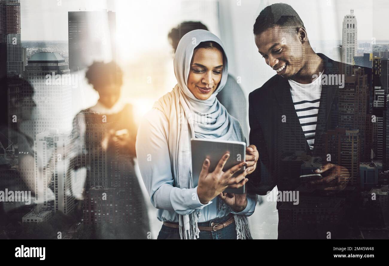 Just another busy day in the office. a group of young cheerful ...