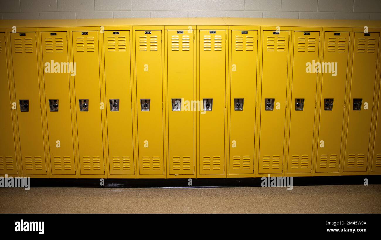 A line of yellow high school lockers Stock Photo - Alamy