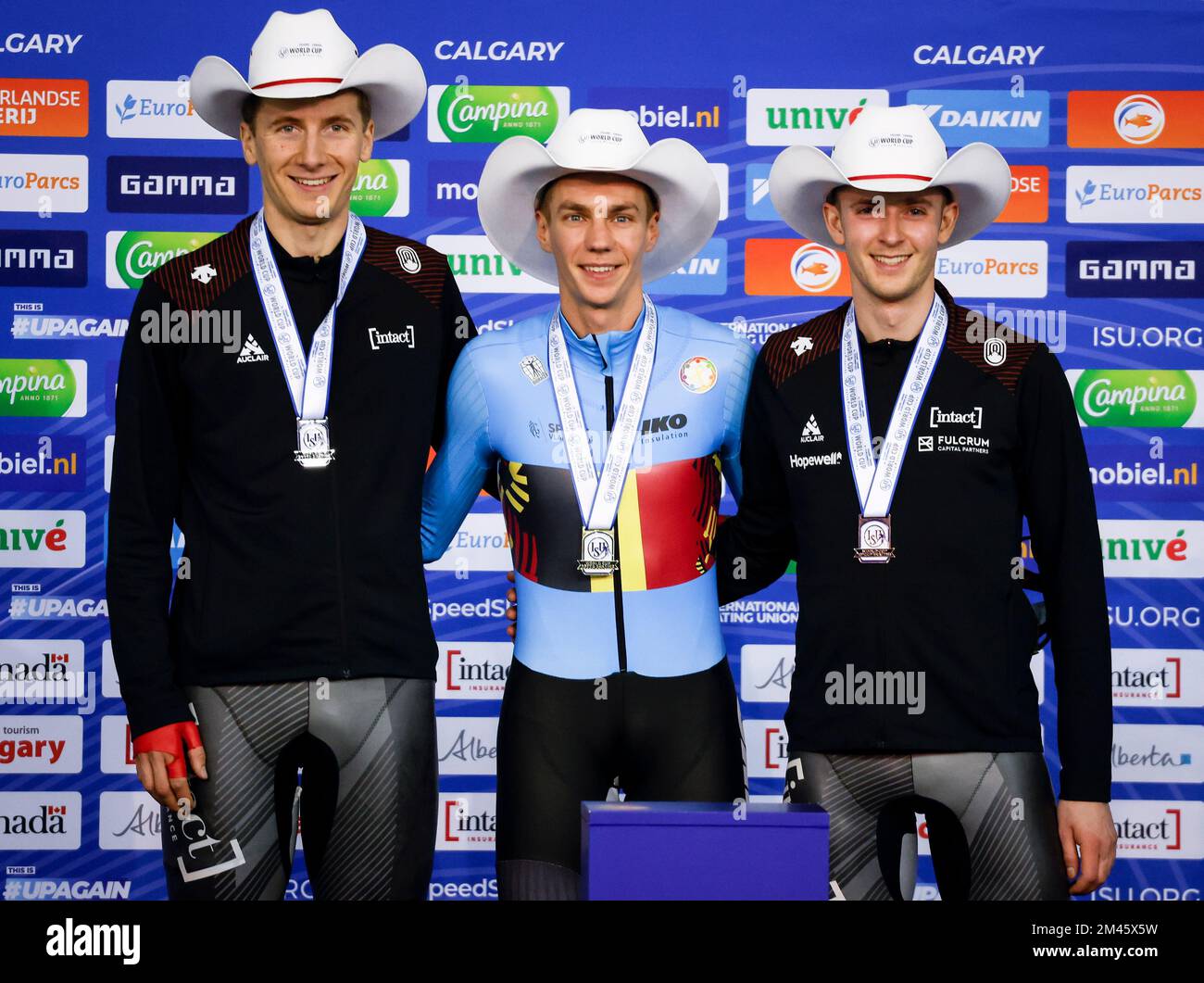 Belgium's Bart Swings, centre, celebrates his victory with second place ...