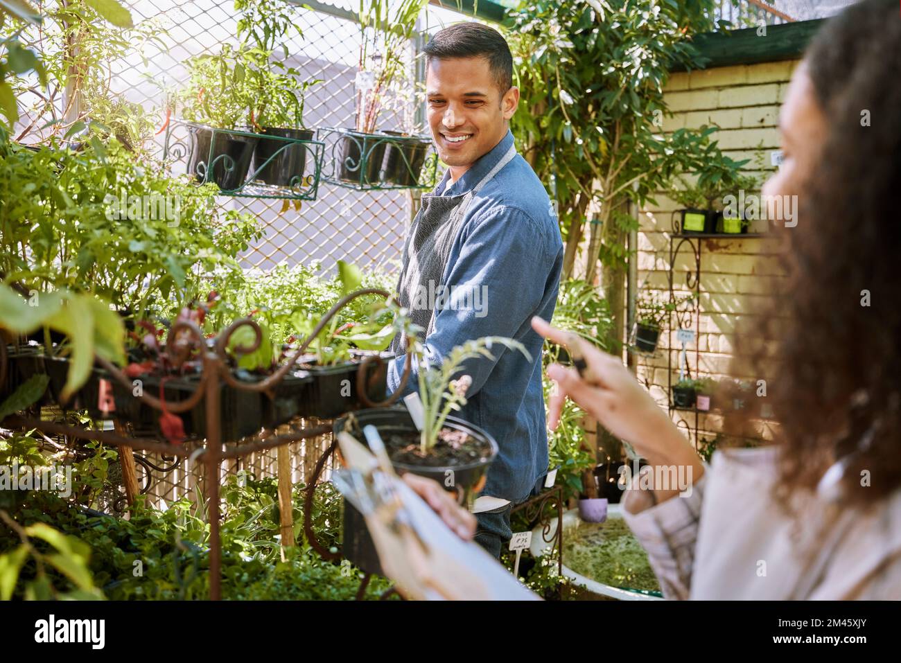 Gardening, flowers and plants with a couple checking in the garden ...