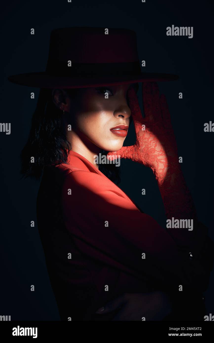 Dark, woman and spotlight with a model black woman in studio on a black ...