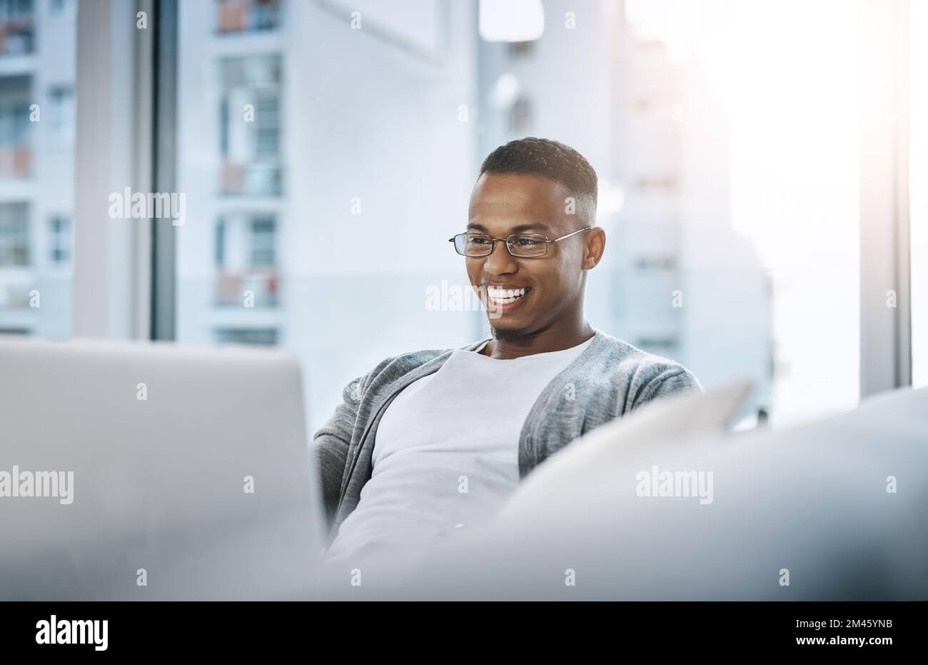 Im only going back to work next week. a handsome young man using his ...