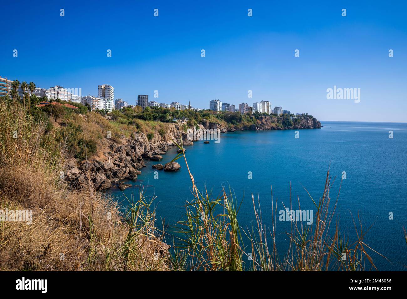 Antalya coast and Houses. There is a tour boat in the sea Stock Photo ...