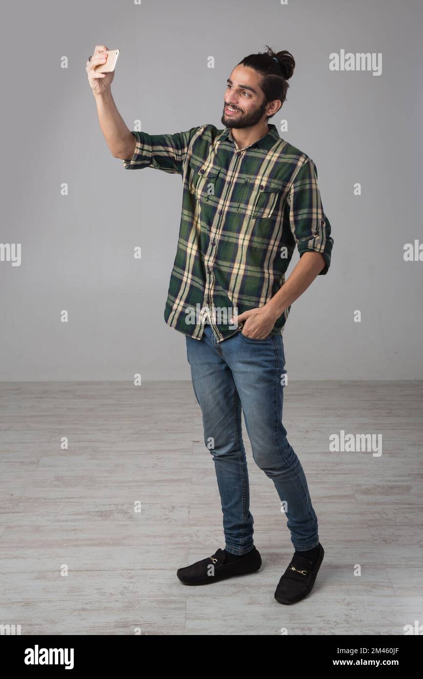 Portrait of an Expat Arab.Portrait of an Expat Arab taking a selfie ...