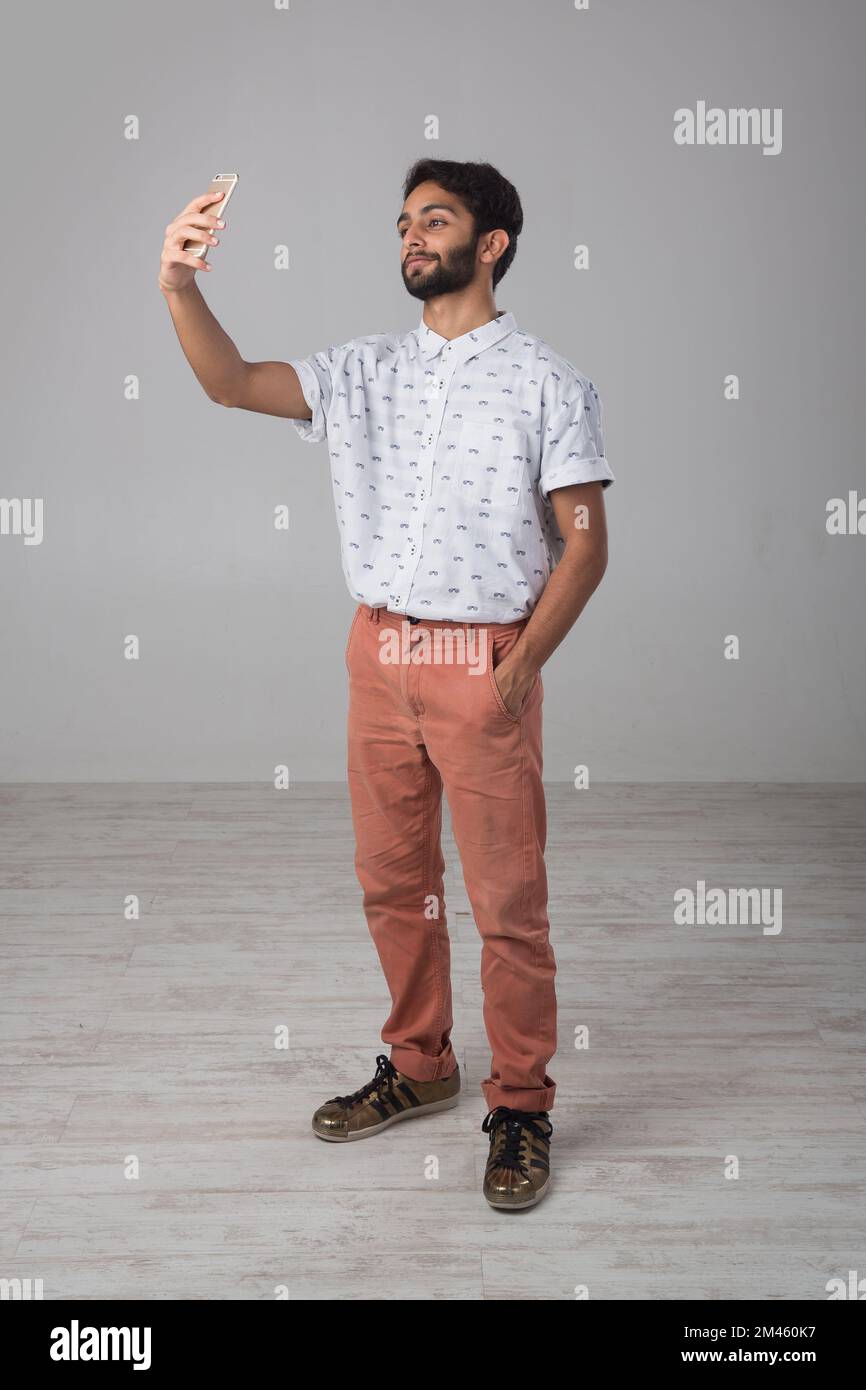 Portrait of an Expat Arab.Portrait of an Expat Arab taking a selfie ...