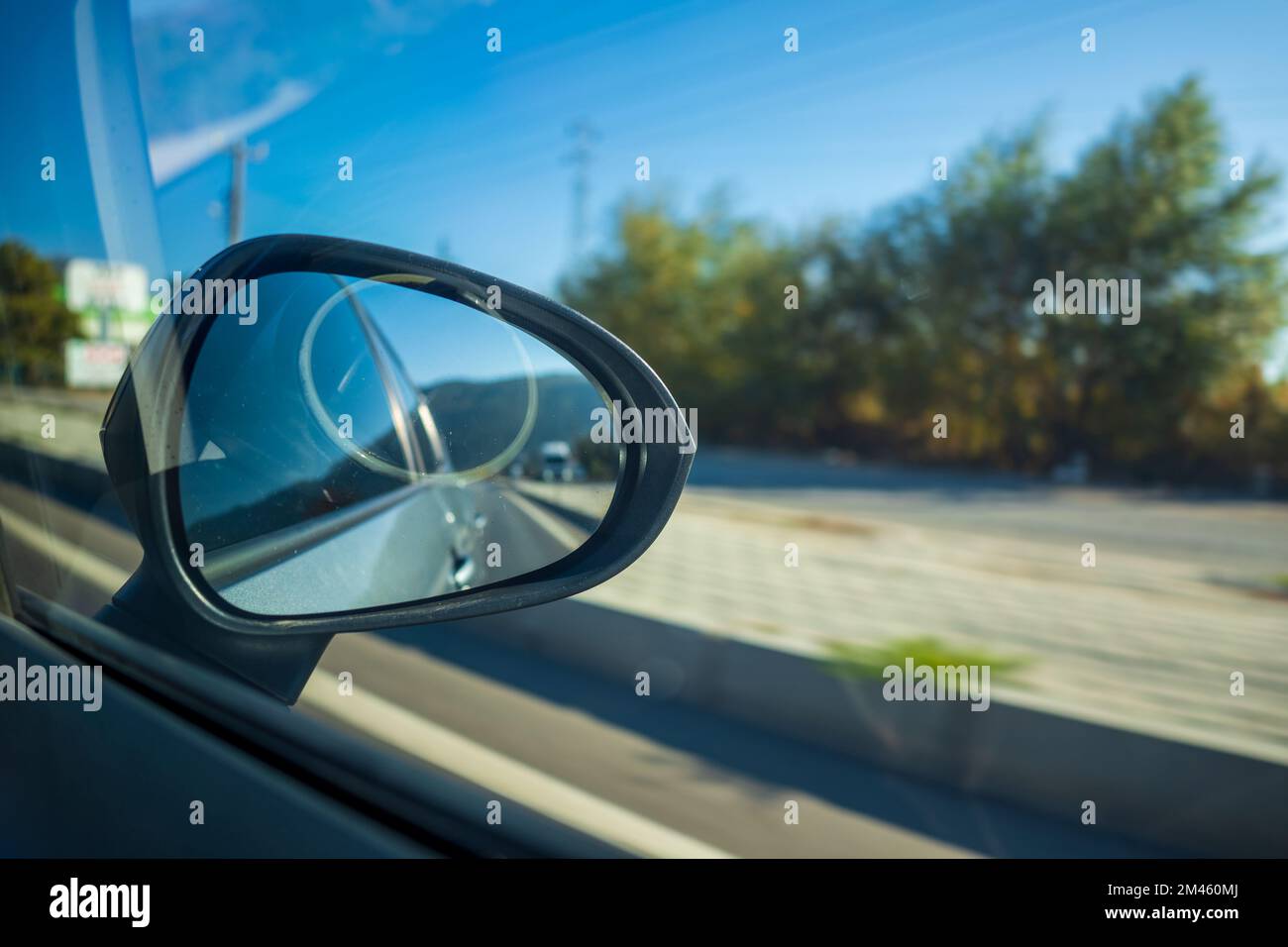 The road visible in the mirror inside the car Stock Photo - Alamy
