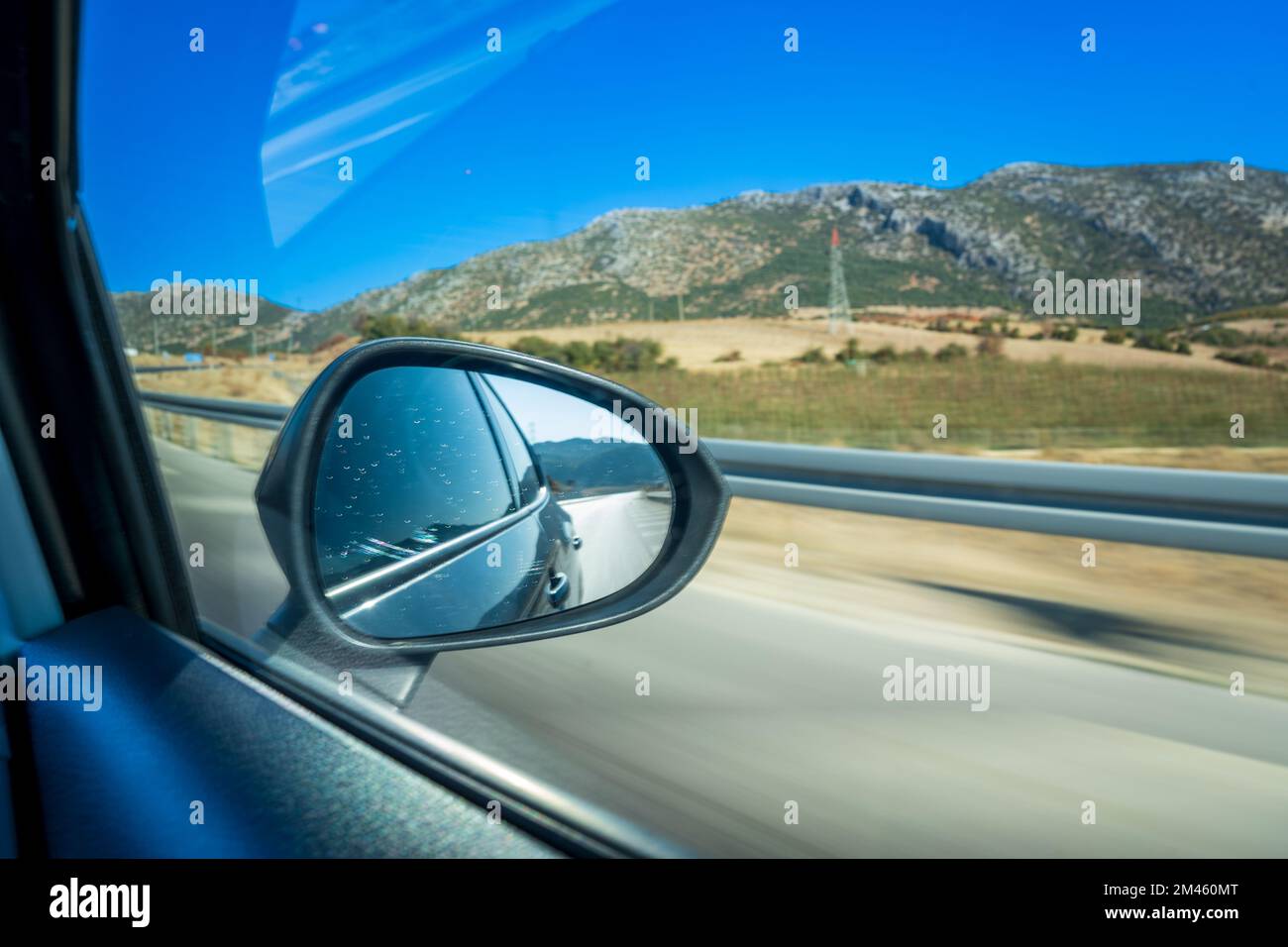 The road visible in the mirror inside the car Stock Photo - Alamy