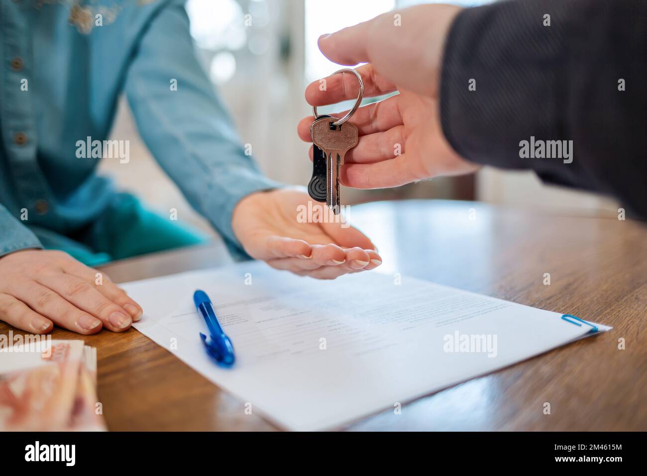 World leasing day. The realtor gives the keys to the buyer of the ...