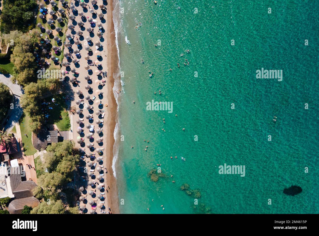 An aerial of people on vacation under beach umbrellas on St. Nicholas ...