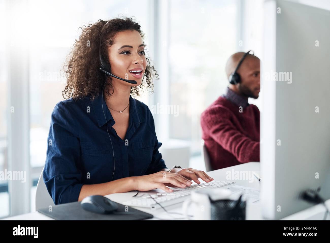 Working hard to solve your problems. an attractive young female call ...