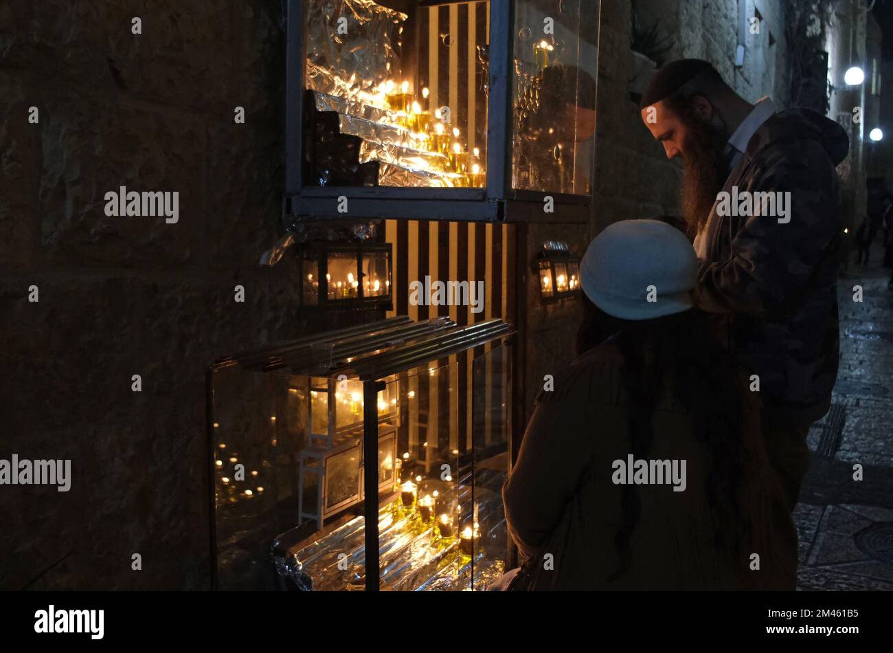 JERUSALEM, ISRAEL - DECEMBER 18: Religious Jews light Hanukkah candles ...