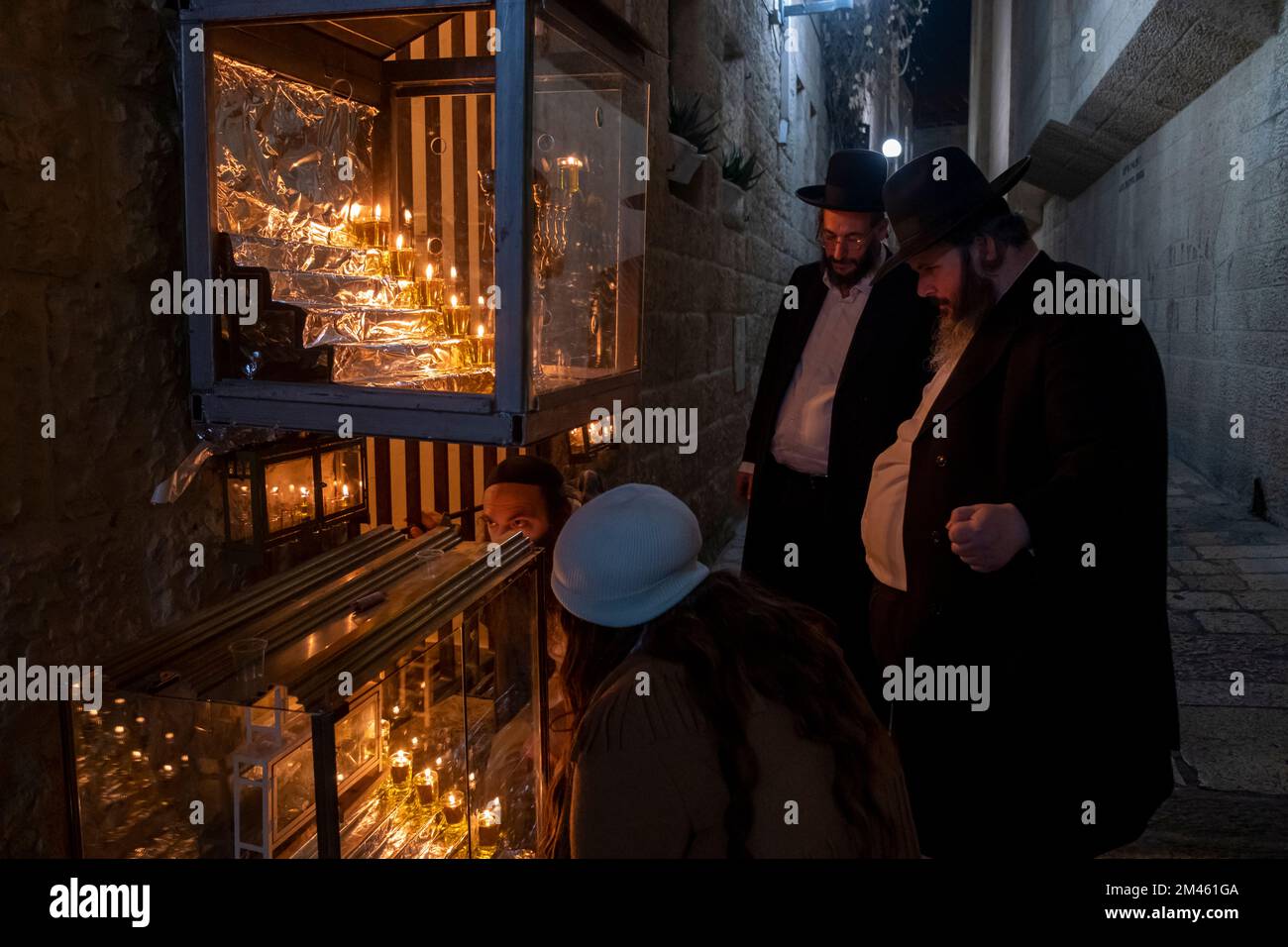 JERUSALEM, ISRAEL - DECEMBER 18: Religious Jews light Hanukkah candles ...