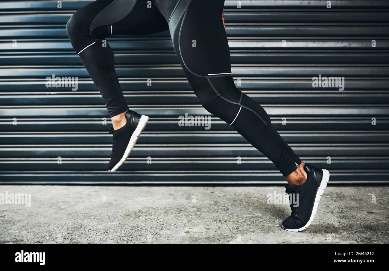 Run in the direction of your goals. Closeup shot of a sporty man ...