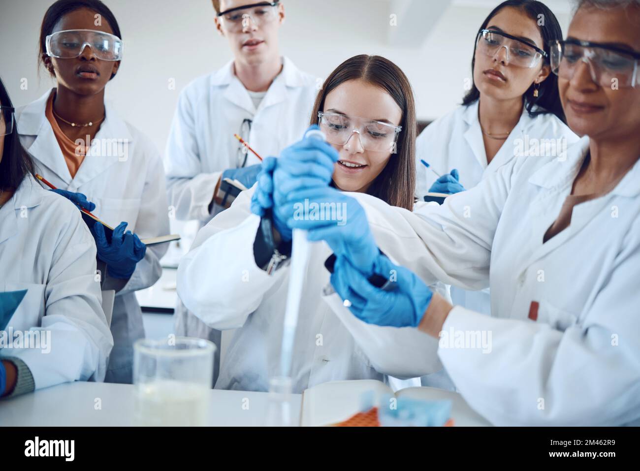 Research, students and professor for medical innovation, laboratory or ...