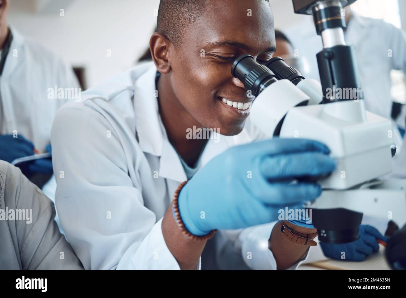 Science, microscope and students learning in class, classroom physics ...