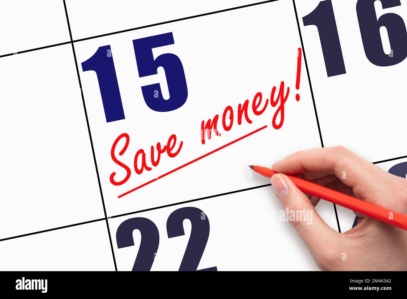 15th day of the month. Hand writing text SAVE MONEY and drawing a line ...