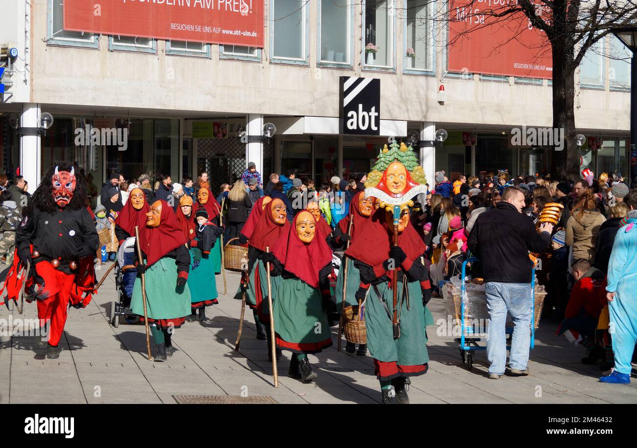 people dressed up in funny clothes and masks celebrating traditional ...