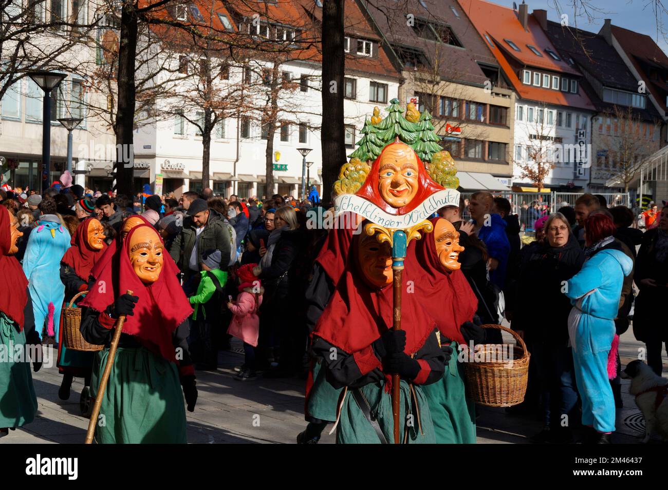 people dressed up in funny clothes and masks celebrating traditional ...