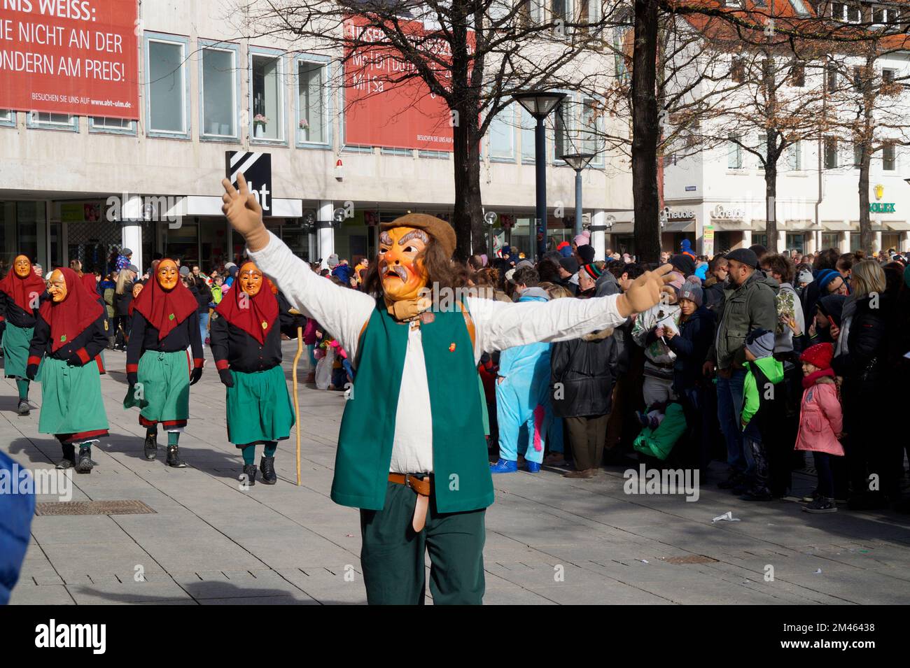 people dressed up in funny clothes and masks celebrating traditional ...