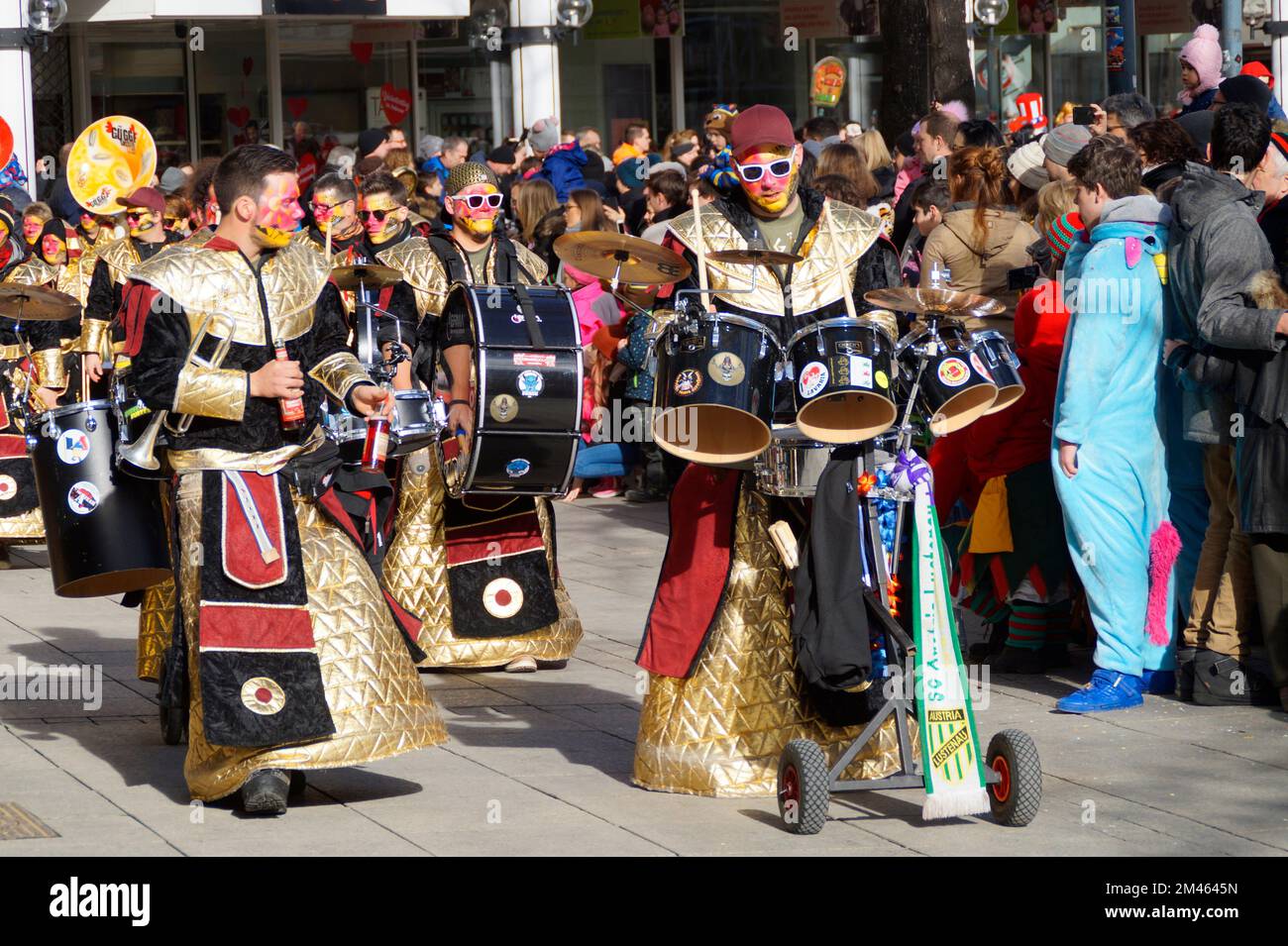 people dressed up in funny clothes and masks celebrating traditional ...