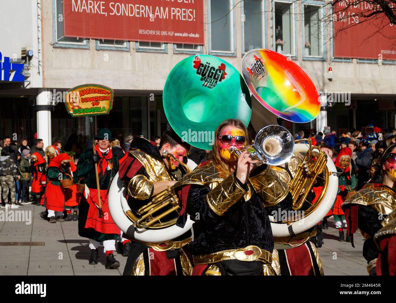 people dressed up in funny clothes and masks celebrating traditional ...