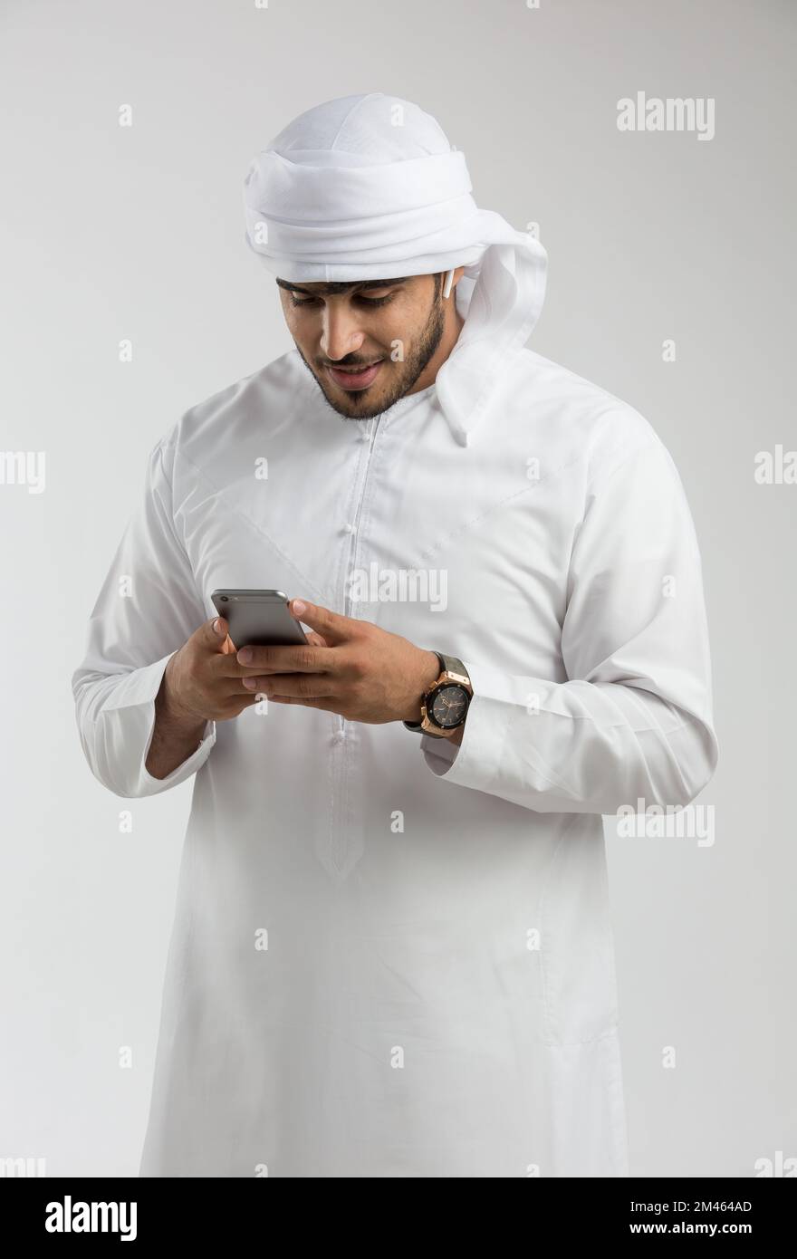Emirati man headphones hi-res stock photography and images - Alamy