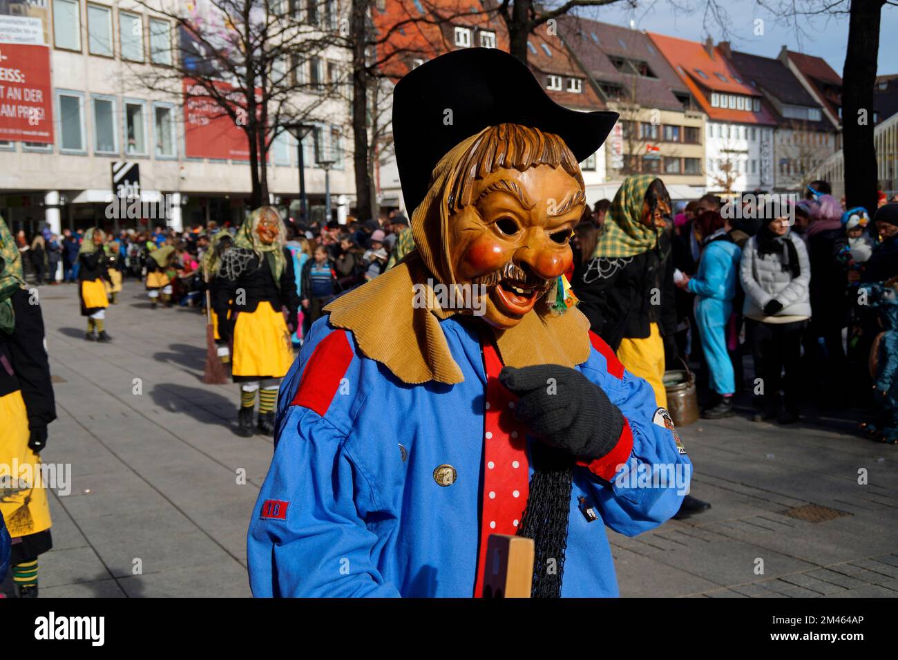 people dressed up in funny clothes and masks celebrating traditional ...
