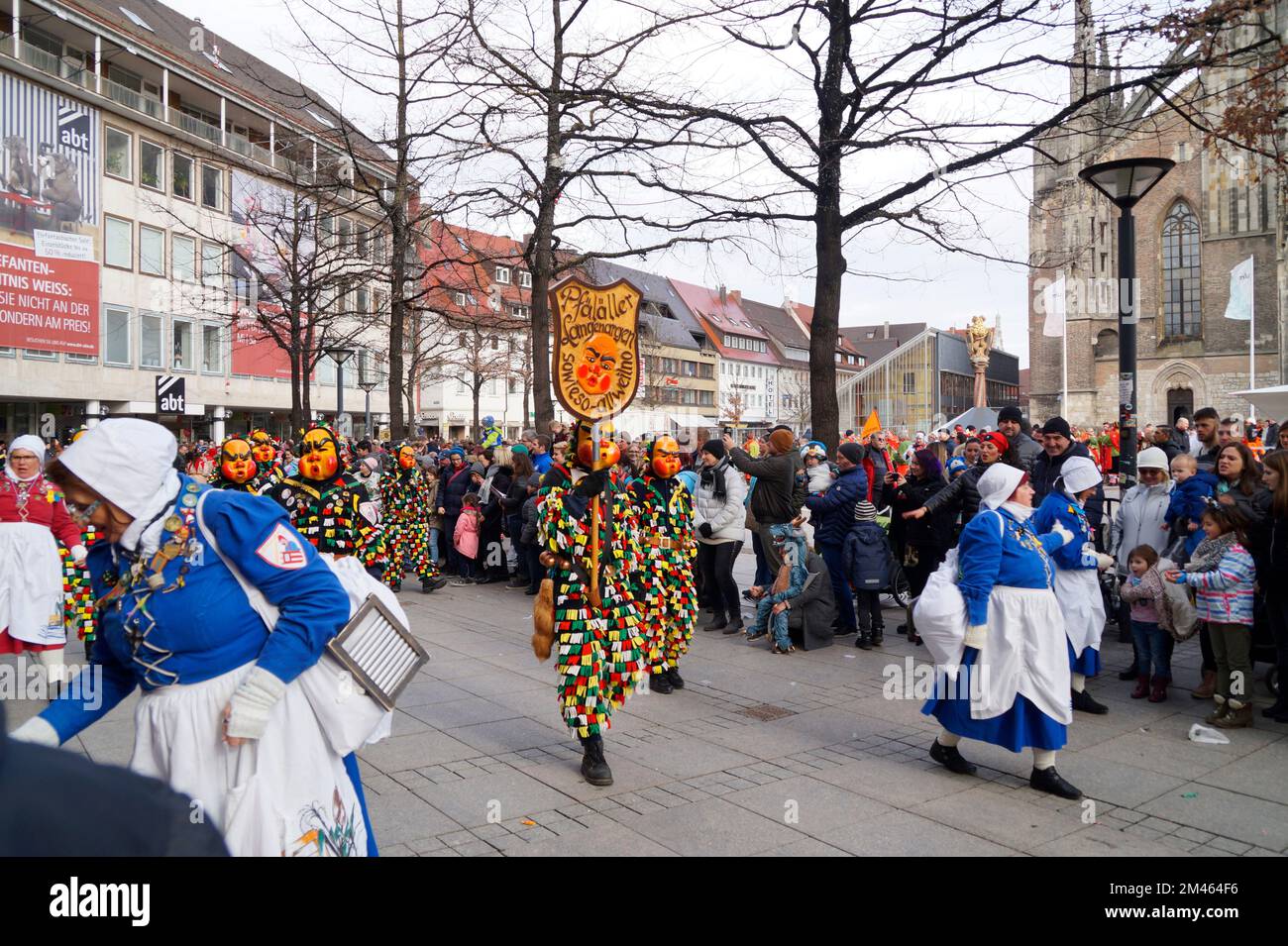 people dressed up in funny clothes and masks celebrating traditional ...