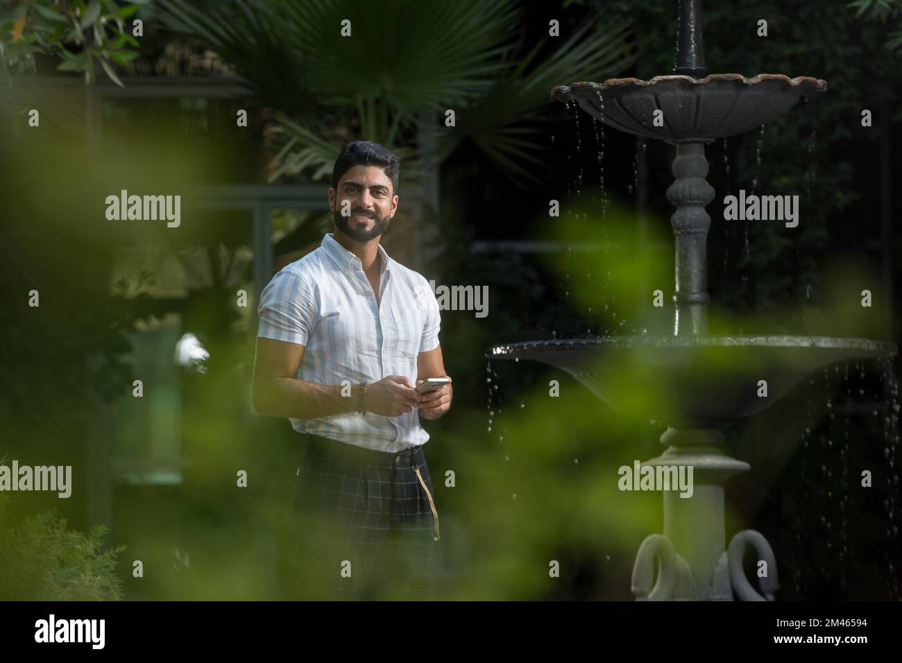 Portrait of an expat man on his mobile Stock Photo - Alamy