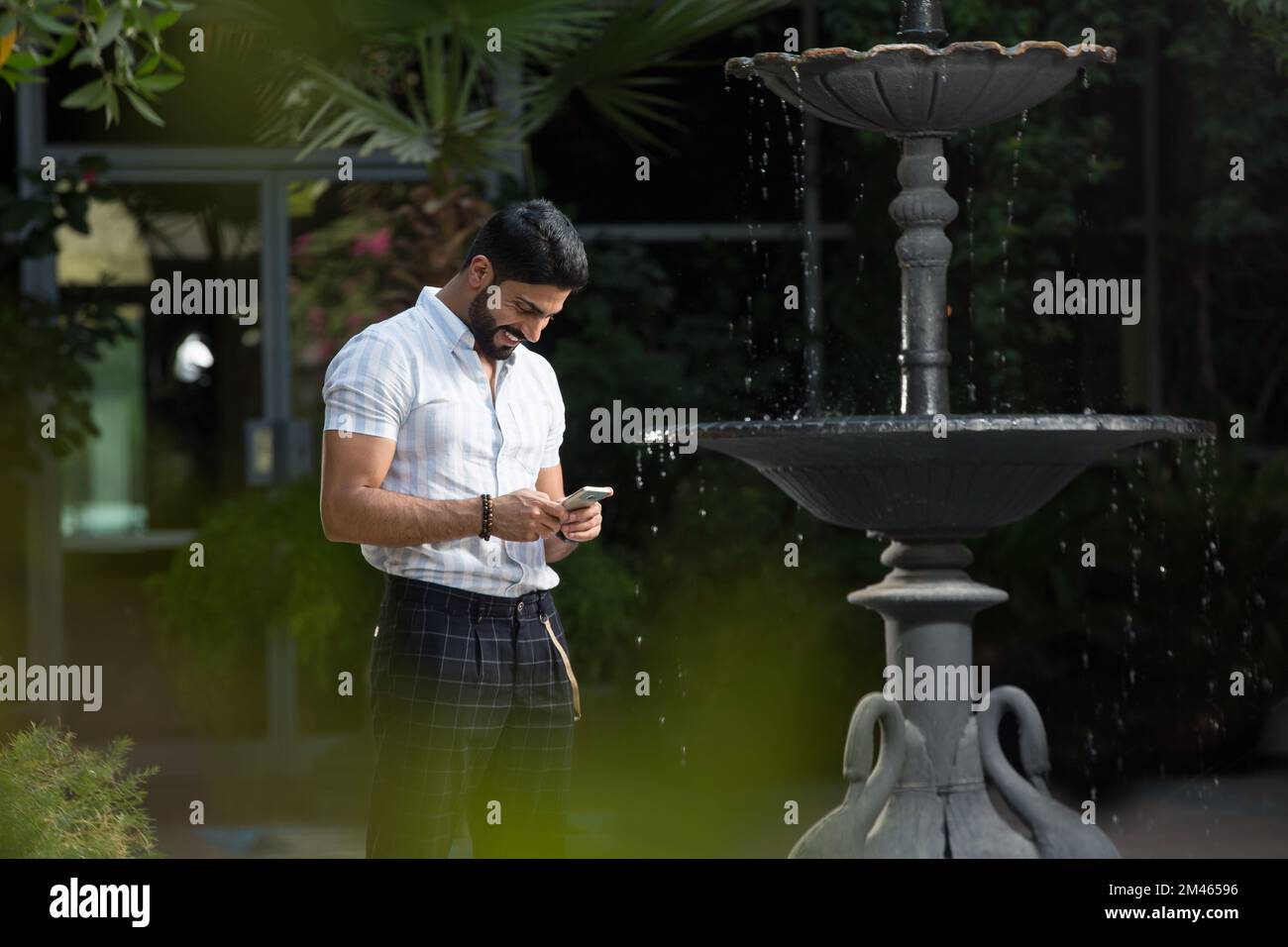 Portrait of an expat man on his mobile Stock Photo - Alamy