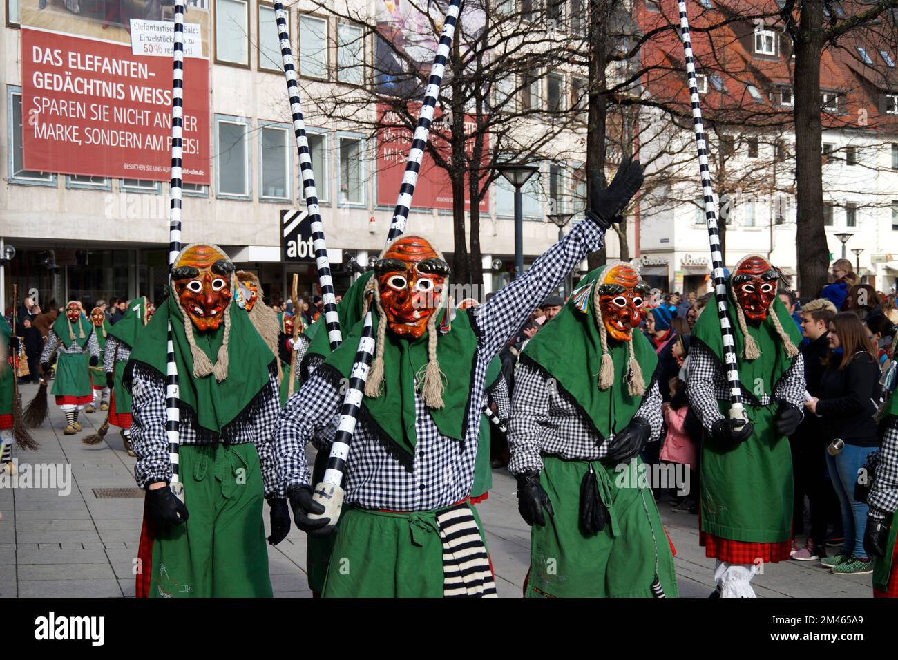 people dressed up in funny clothes and masks celebrating traditional ...