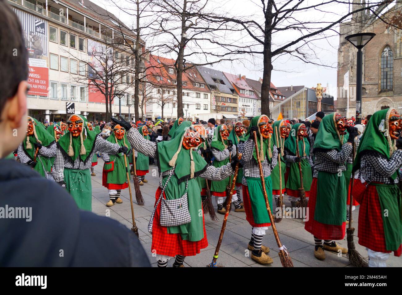 people dressed up in funny clothes and masks celebrating traditional ...