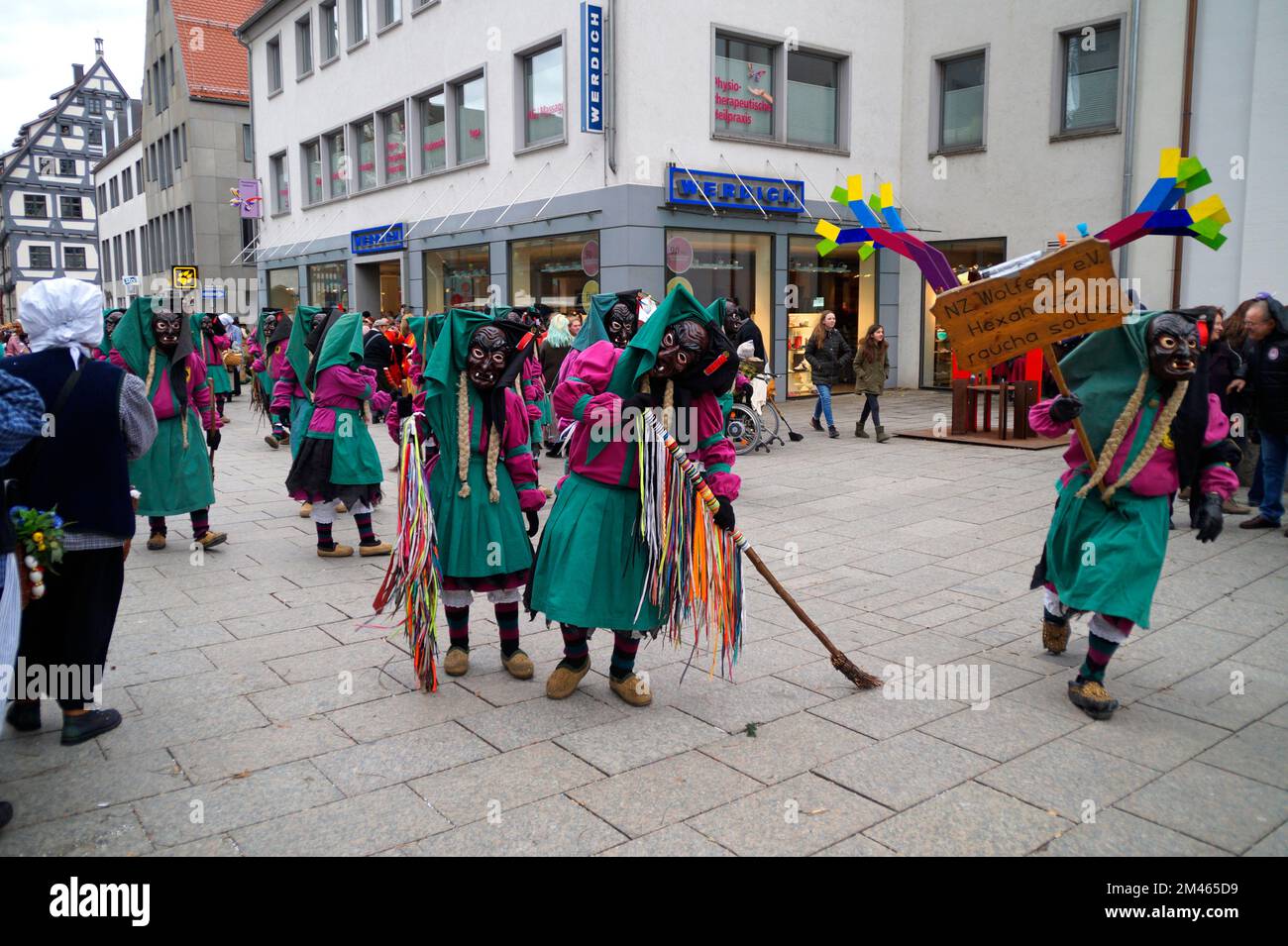 people dressed up in funny clothes and masks celebrating traditional ...