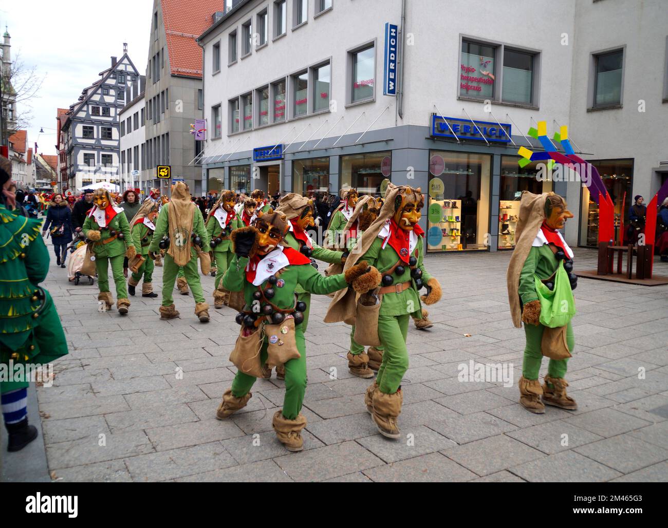 people dressed up in funny clothes and masks celebrating traditional ...