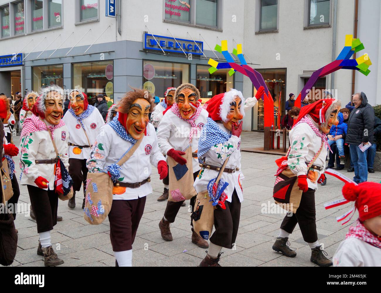 people dressed up in funny clothes and masks celebrating traditional ...