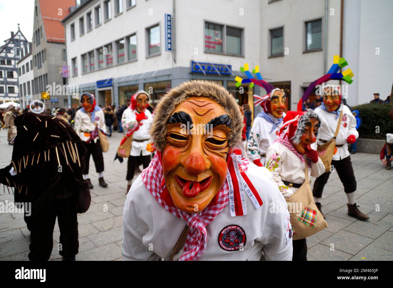 people dressed up in funny clothes and masks celebrating traditional ...