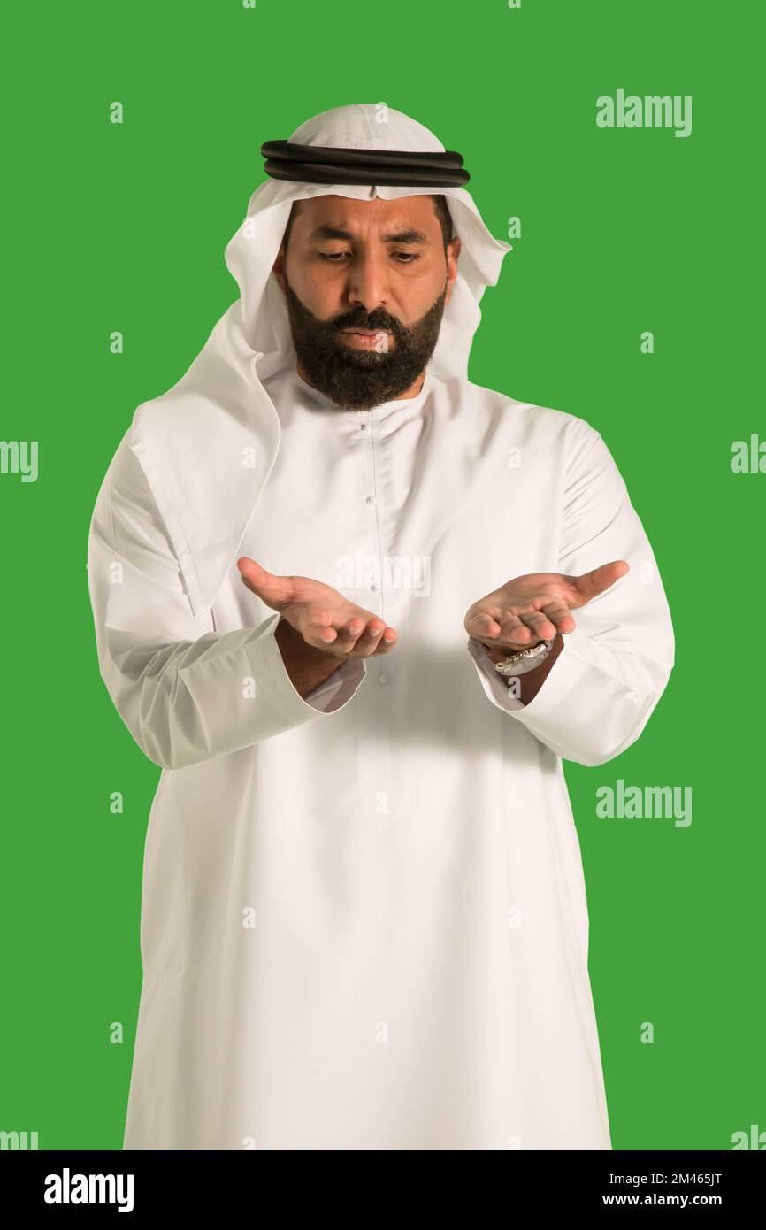 Arab man holding object Stock Photo - Alamy