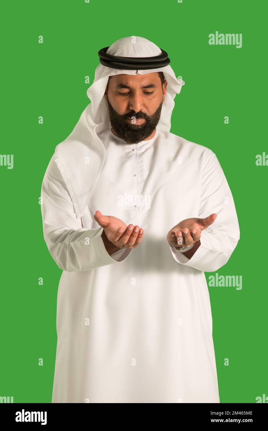 Arab man holding object Stock Photo - Alamy