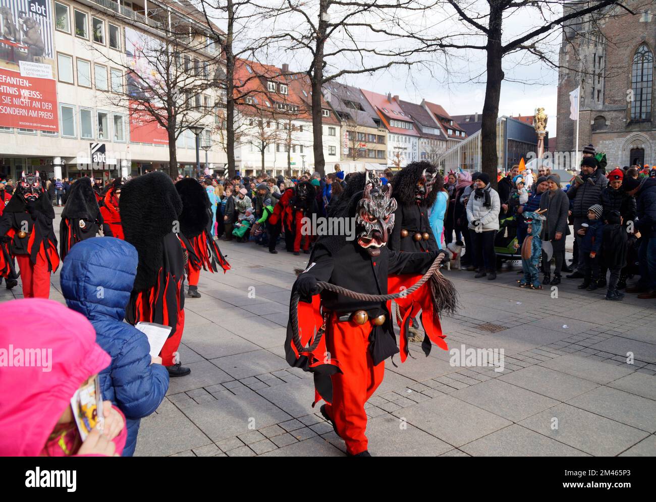 people dressed up in funny clothes and masks celebrating traditional ...