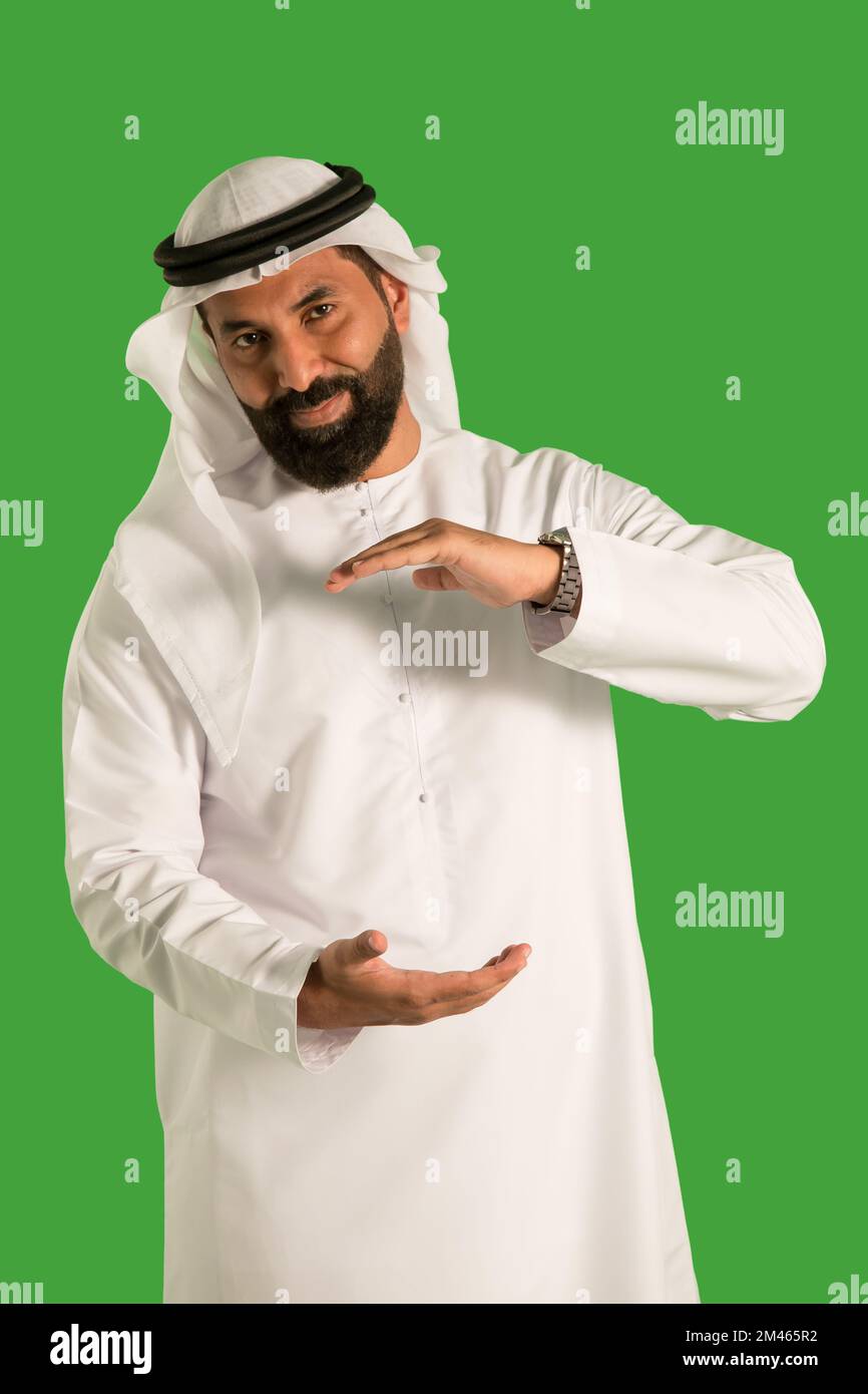 Arab man holding object Stock Photo - Alamy