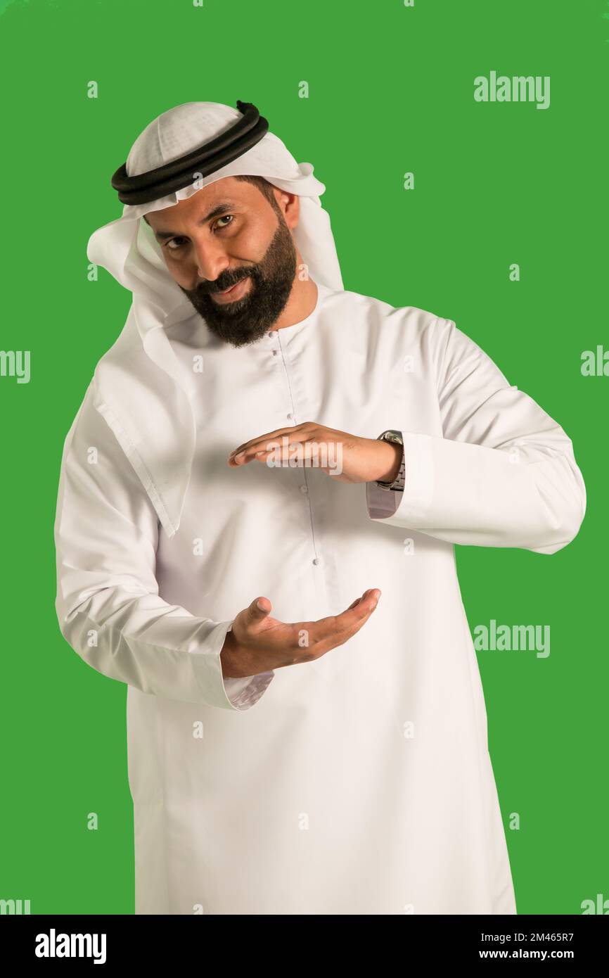 Arab man holding object Stock Photo - Alamy