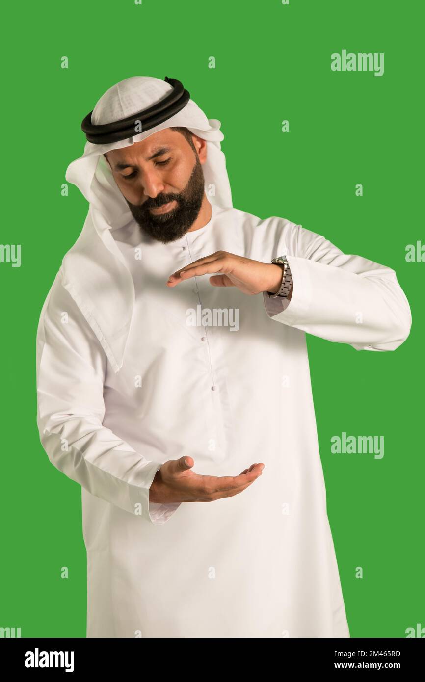 Arab man holding object Stock Photo - Alamy